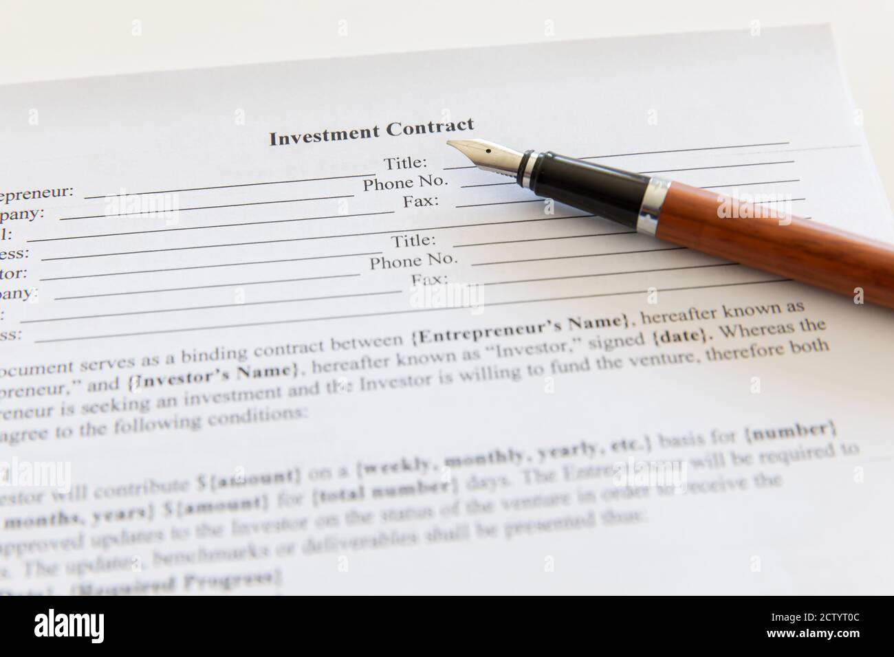 Signing the contract using a wooden fountain pen. Beautiful handwriting ...