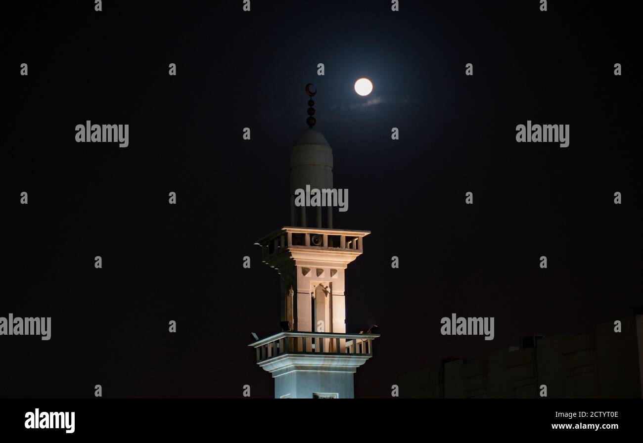 background image of mosque minaret during full moon night. full moon ...