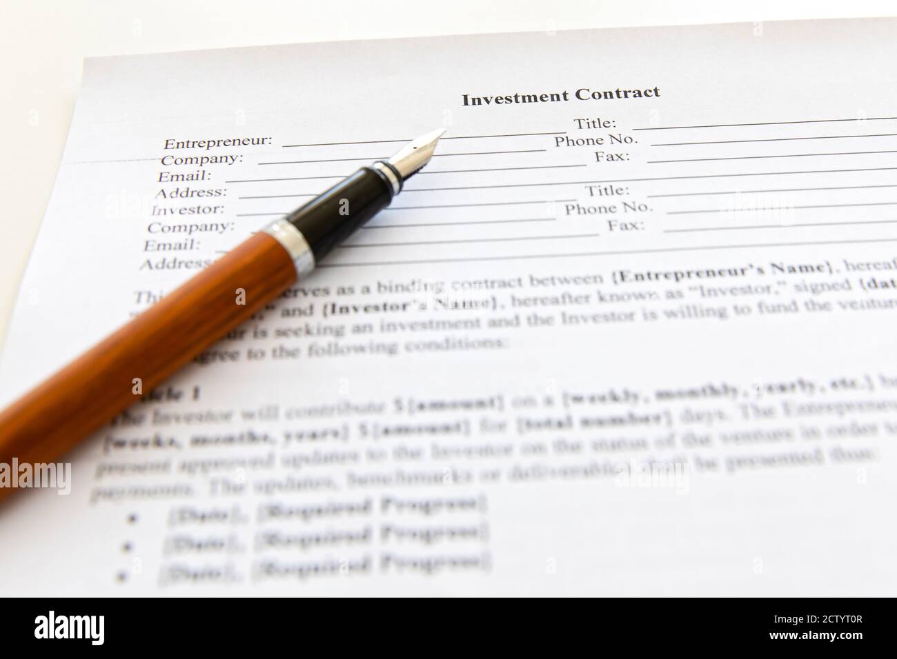 Signing the contract using a wooden fountain pen. Beautiful handwriting ...