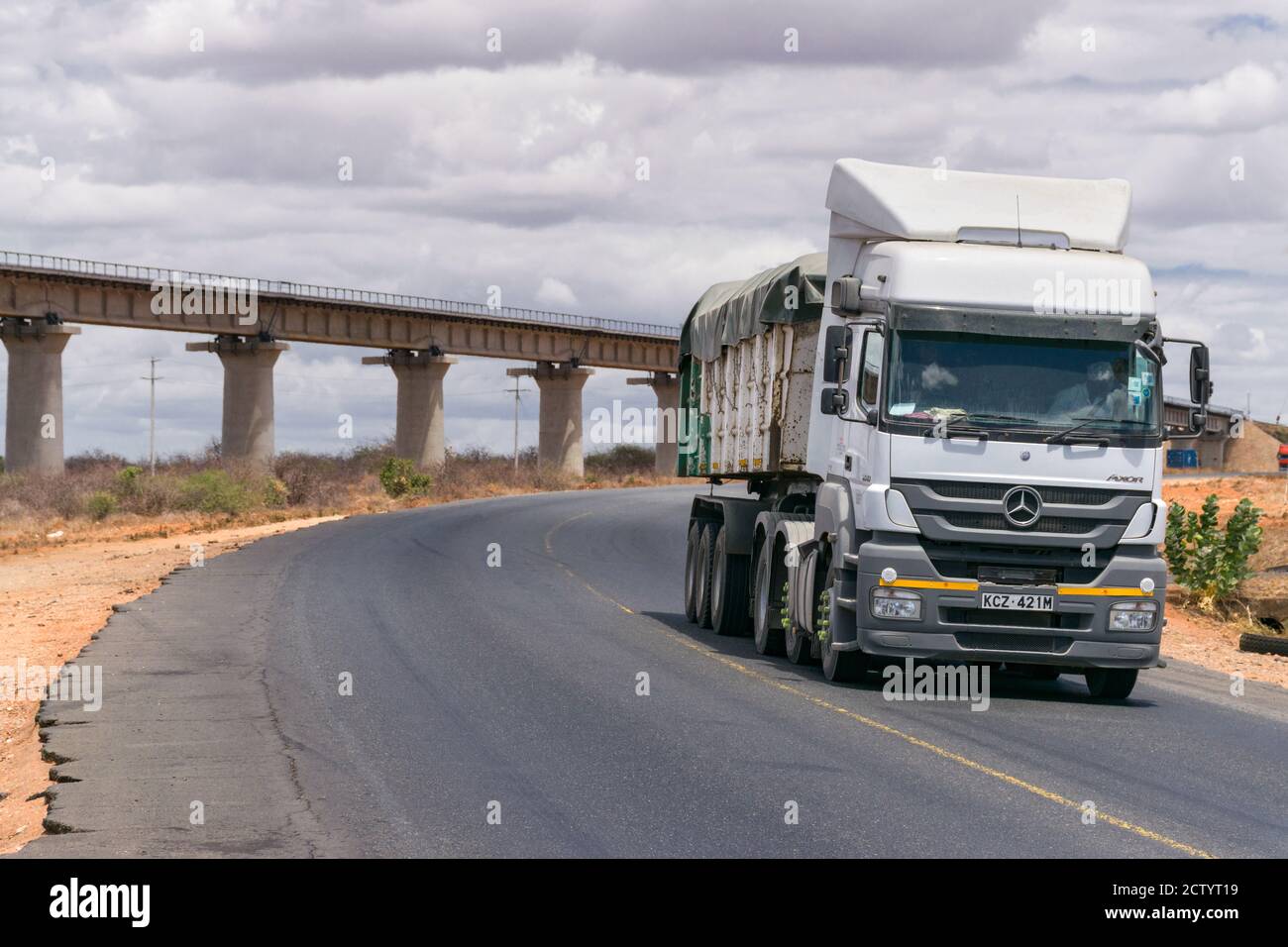 A large truck driving along Mombasa highway carrying goods with SGR ...