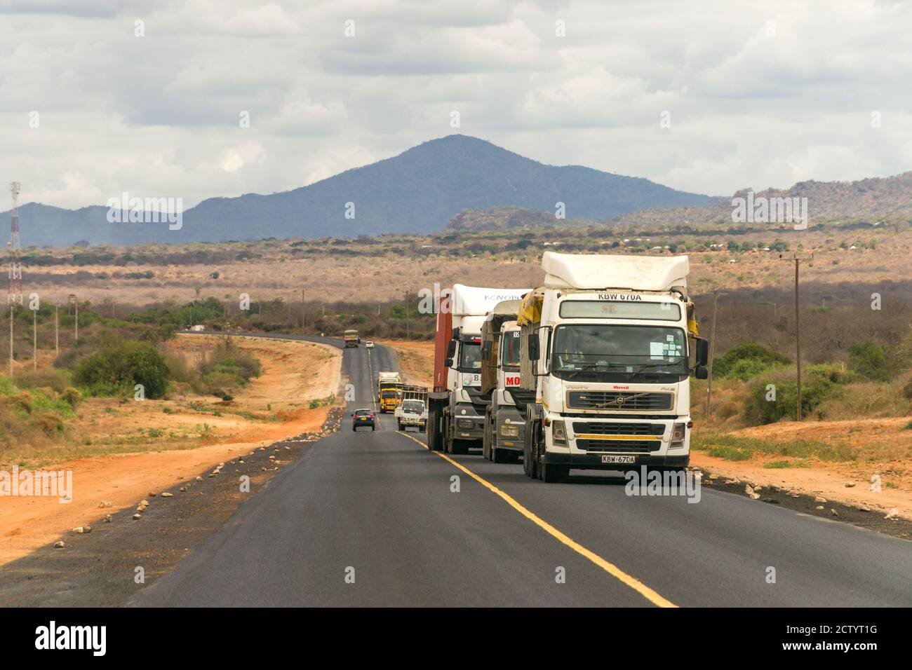 Large trucks driving along Mombasa highway carrying goods, Kenya Stock ...