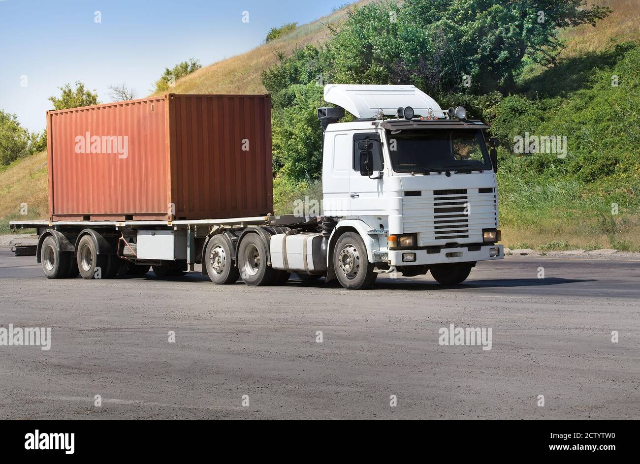 trailer transports container on highway in country Stock Photo - Alamy