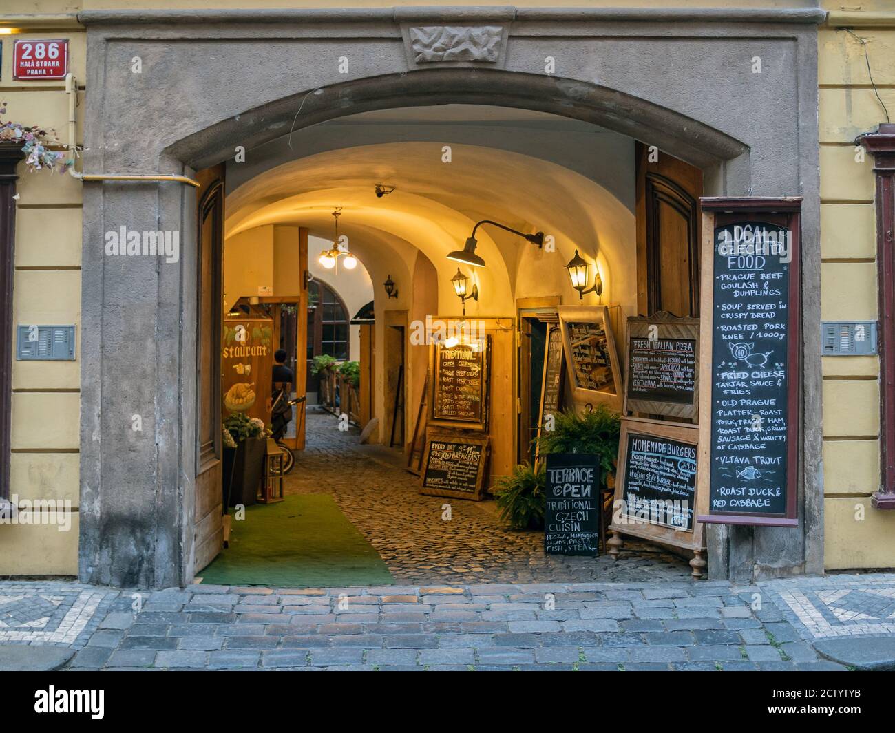PRAGUE, CZECH REPUBLIC: Entrance to pretty restaurant at night with the ...