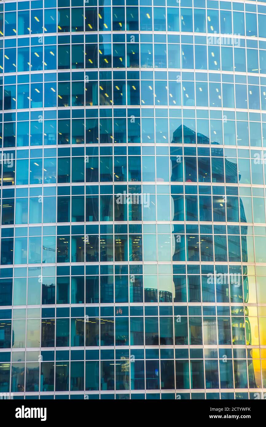 facade of multi-storey office building in evening Stock Photo - Alamy