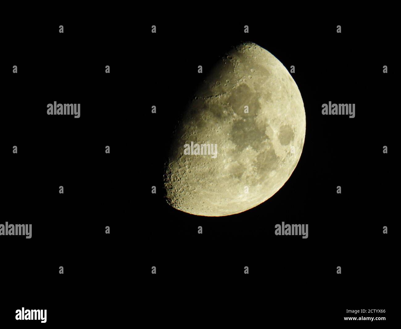 a close-up of the crescent moon with its moon craters Stock Photo - Alamy