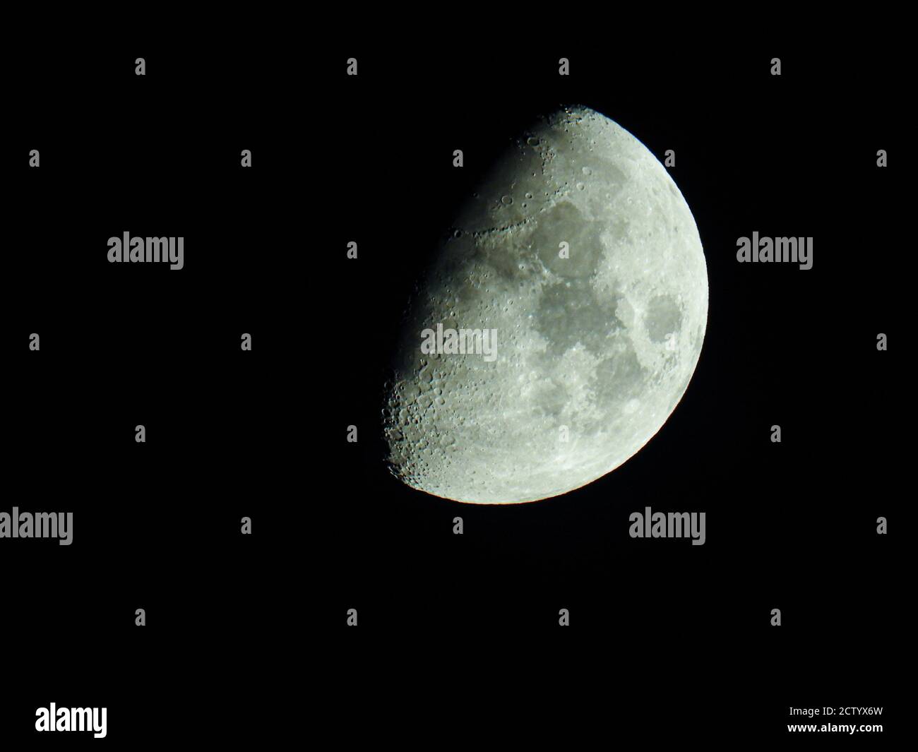 a close-up of the crescent moon with its moon craters Stock Photo - Alamy