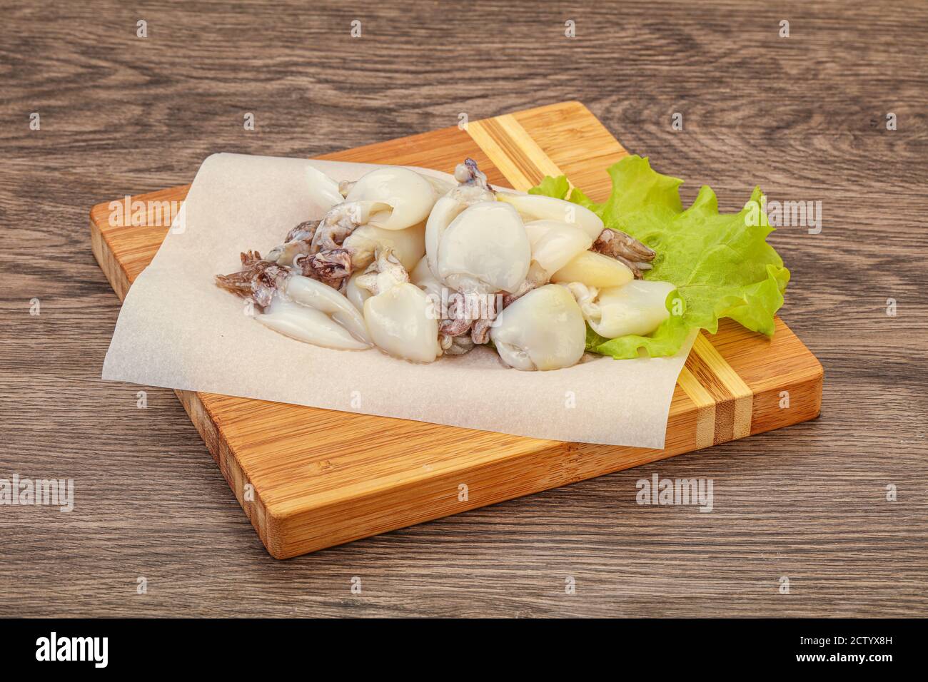 Raw seafood - cuttlefish for cooking over board Stock Photo - Alamy