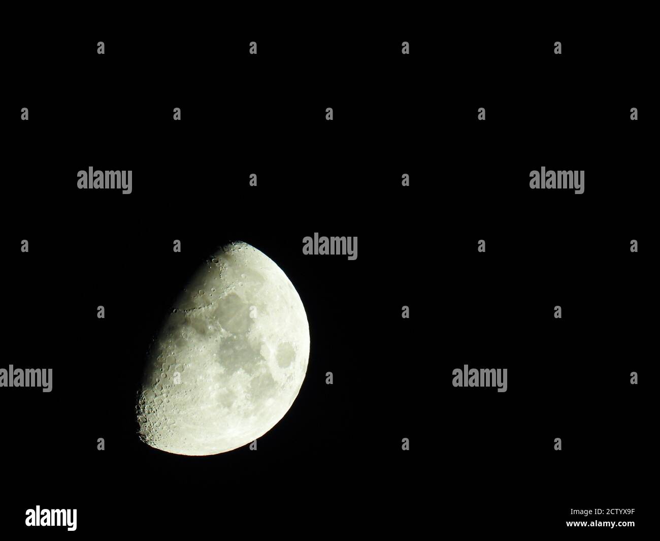 a close-up of the crescent moon with its moon craters Stock Photo - Alamy