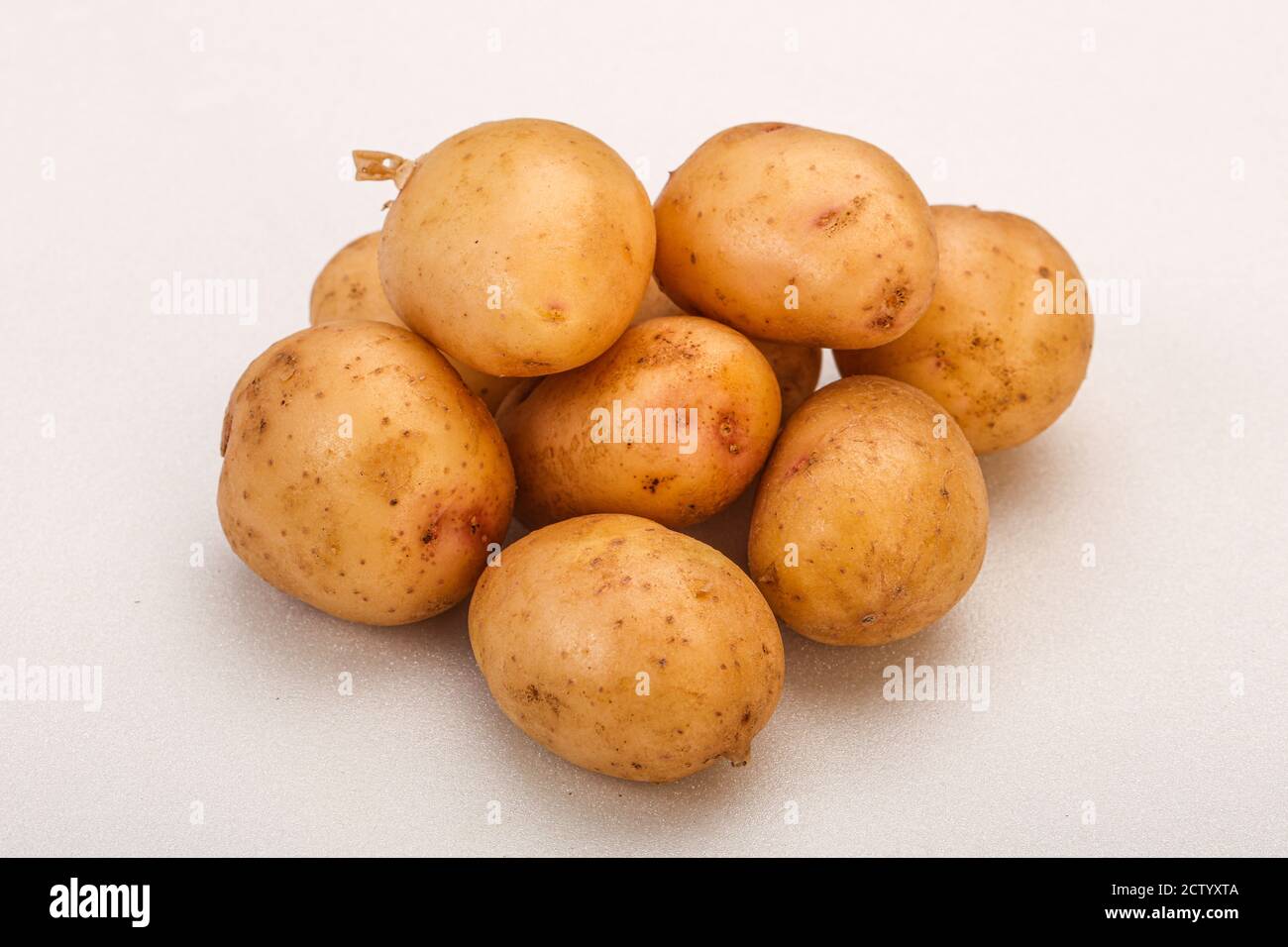 Raw fresh baby young potato heap Stock Photo - Alamy