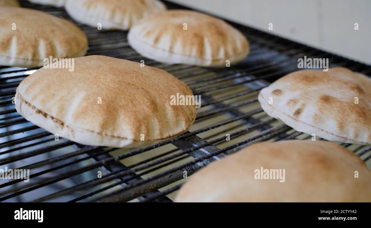Background image of arabic bread produced in a machine.Arabic bread ...