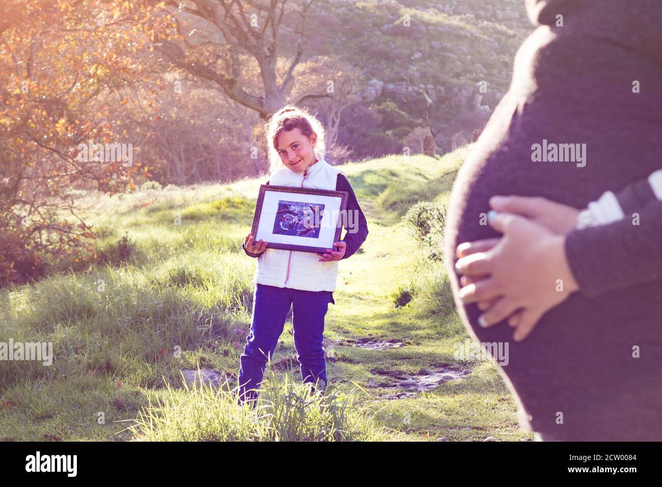 Maternity photo shoot, a father and pregnant mother in a gentle ...