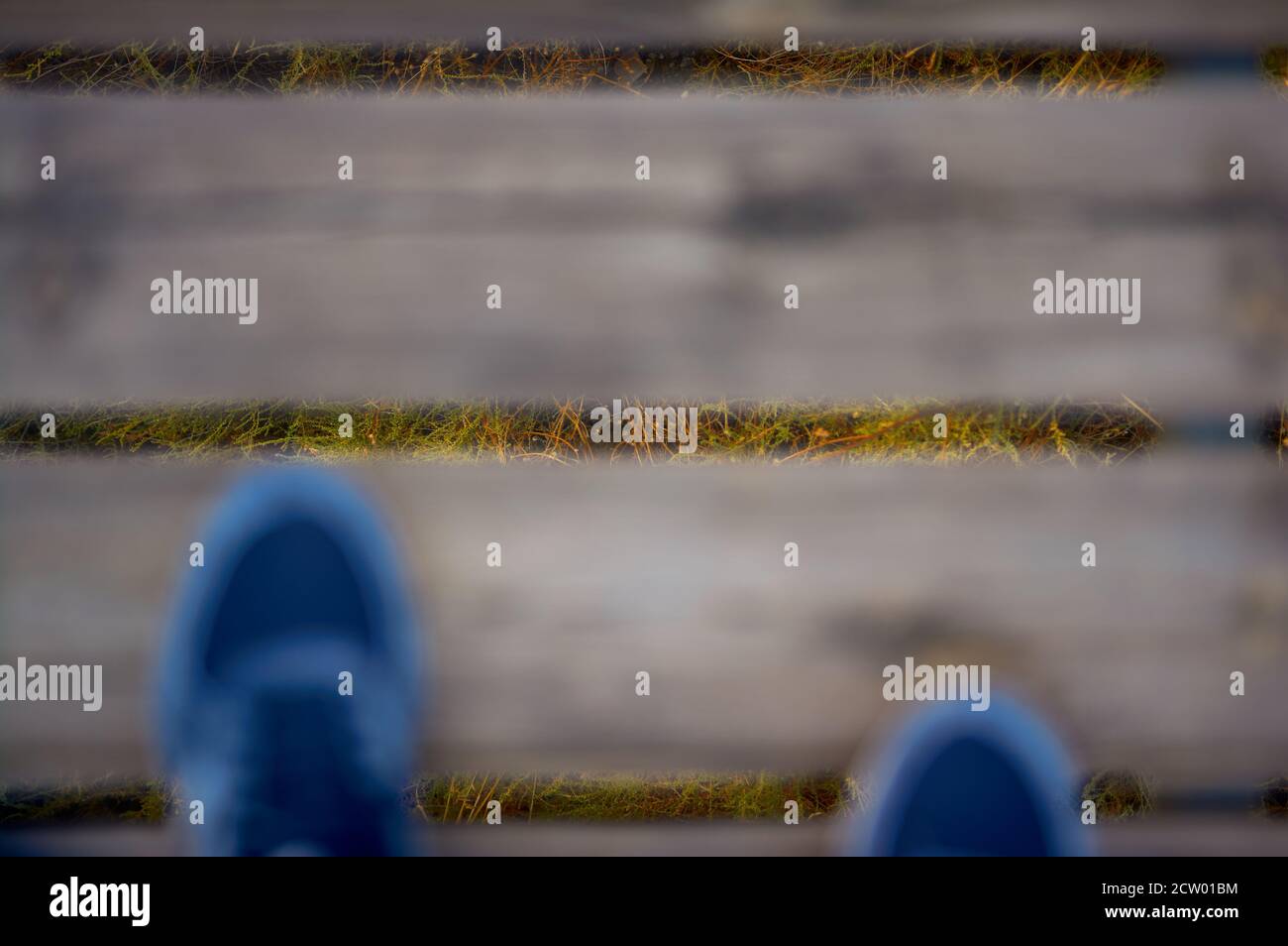 detail of some feet with slippers crossing a wooden bridge Stock Photo ...