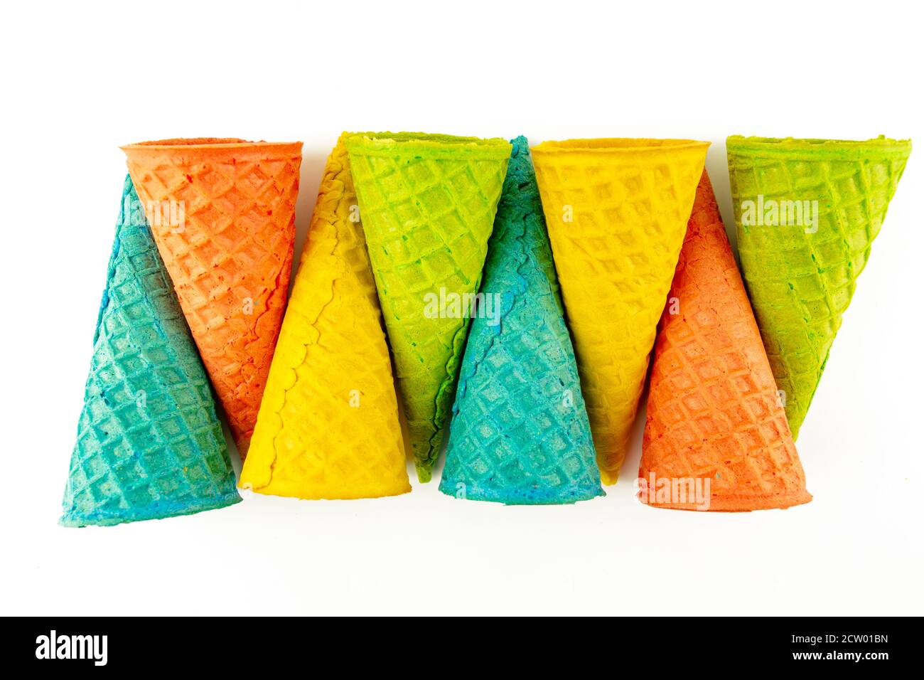 Set of various bright multicolored ice-cream waffle cones on white ...
