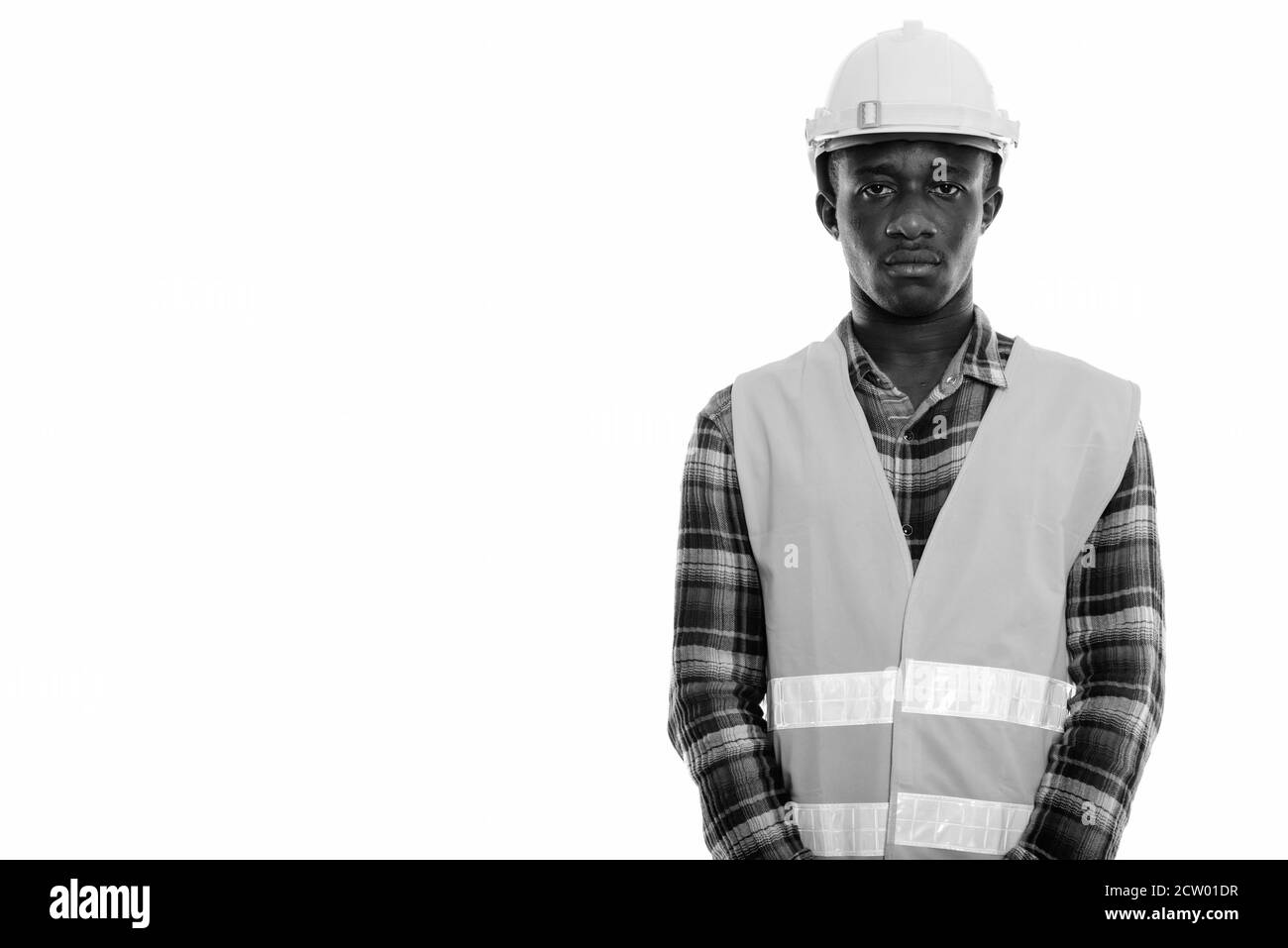 Studio shot of young black African man construction worker Stock Photo ...