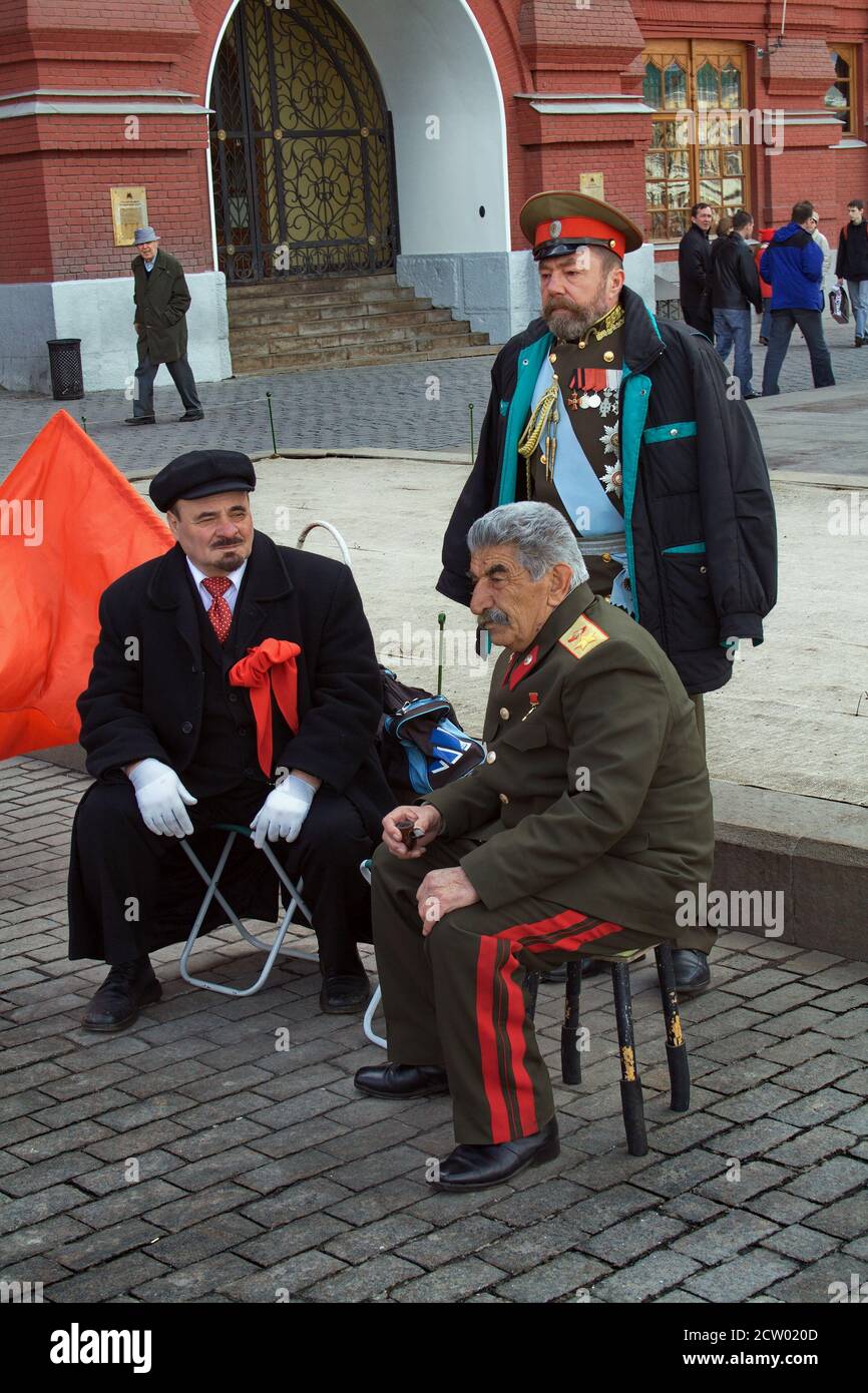 Men imitating Tsar Nicholas II, Lenin and Stalin outside the State ...