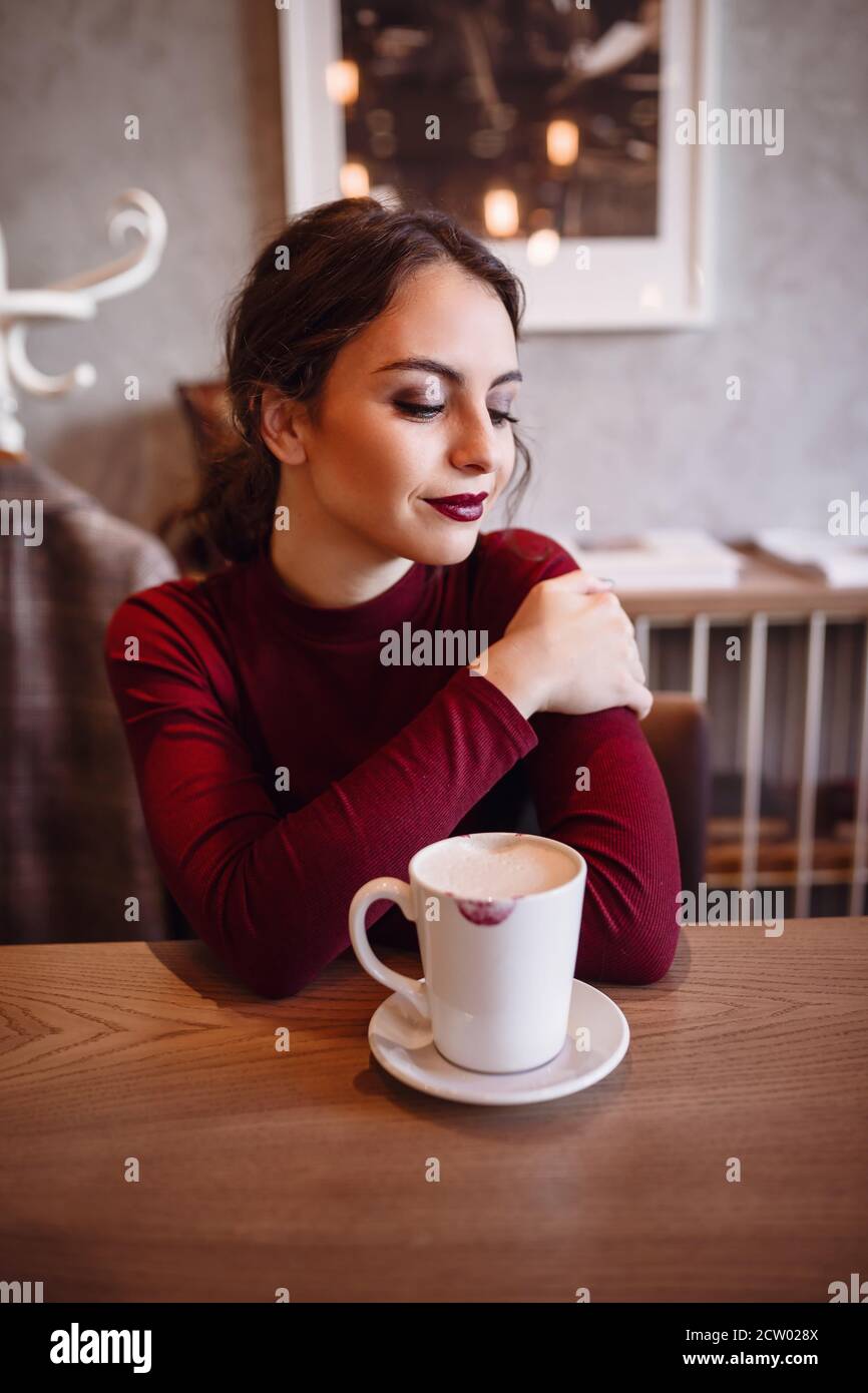 Portrait of woman smiling in coffee shop cafe vintage color tone. young ...