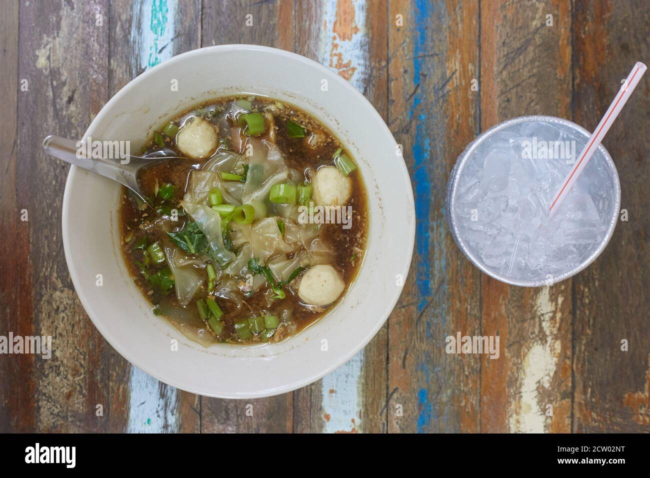 Rice noodles soup with meat ball in a bowl eating by chopsticks, Asian ...