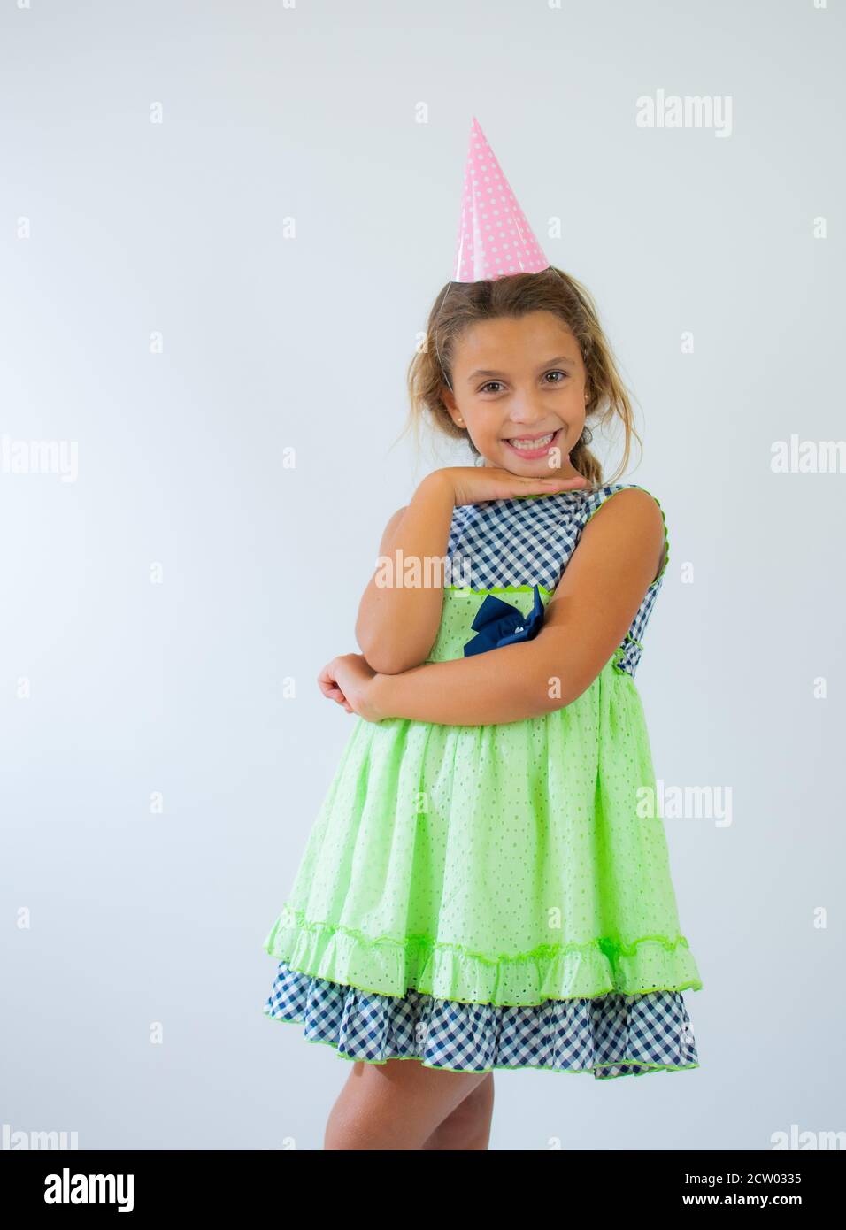 Cute adorable little small girl celebrating birthday standing isolated ...