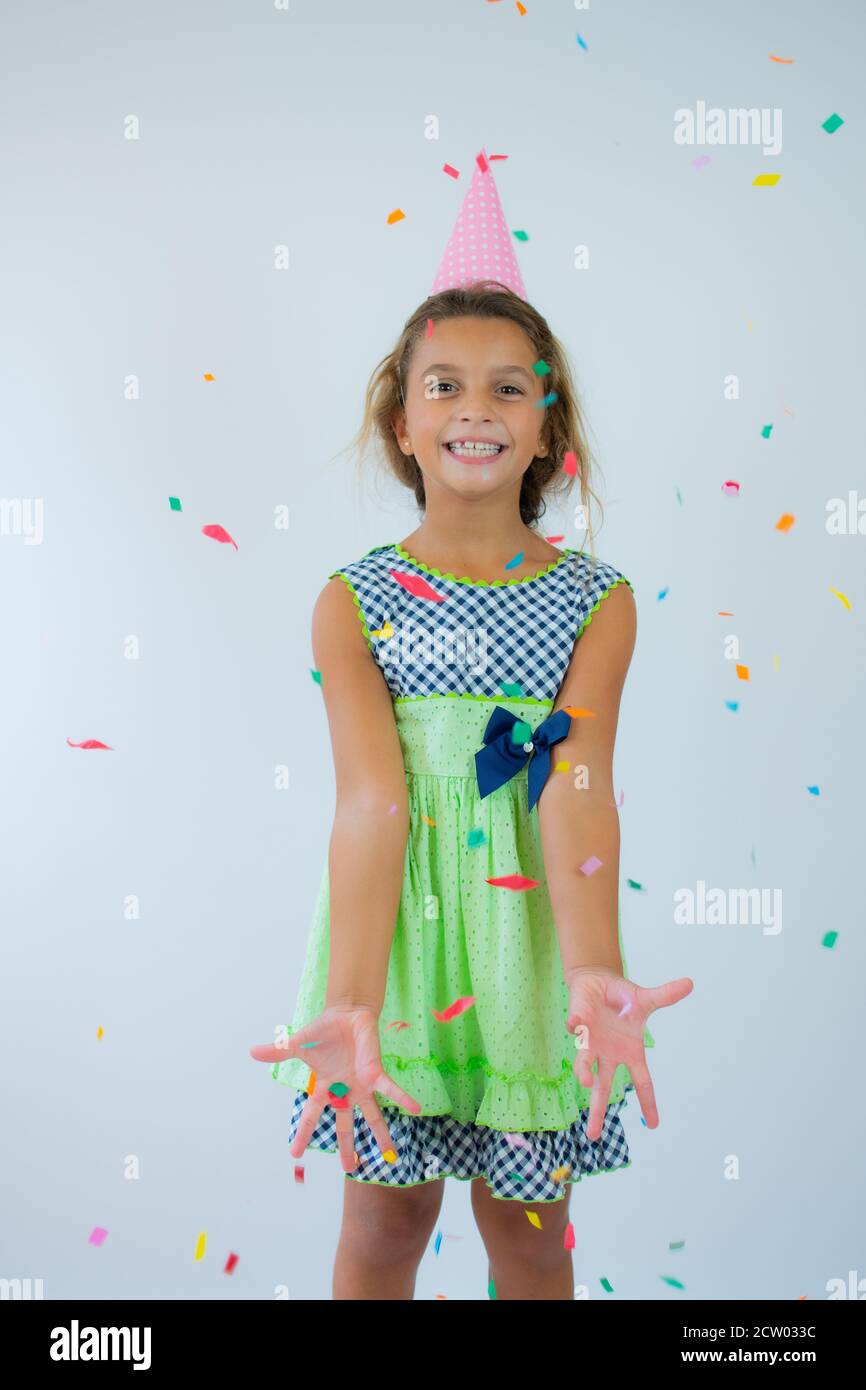 Cute adorable little small girl celebrating birthday standing isolated ...