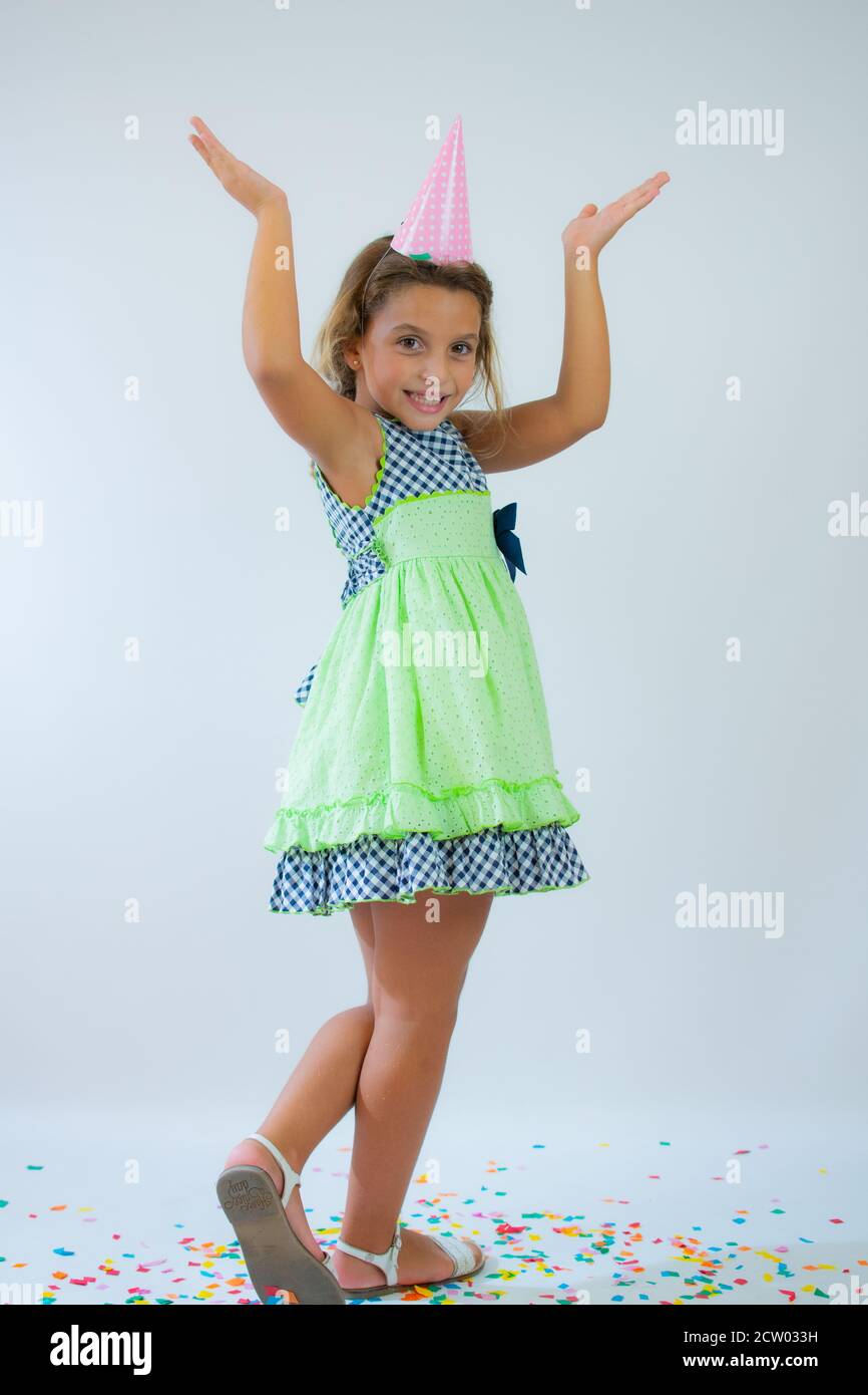 Cute adorable little small girl celebrating birthday standing isolated ...