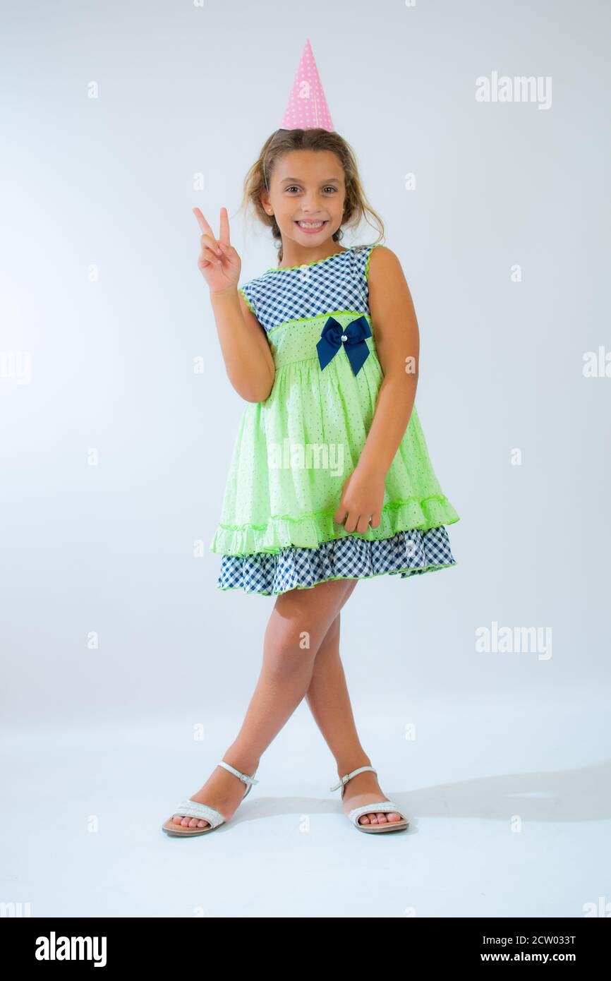 Cute adorable little small girl celebrating birthday standing isolated ...