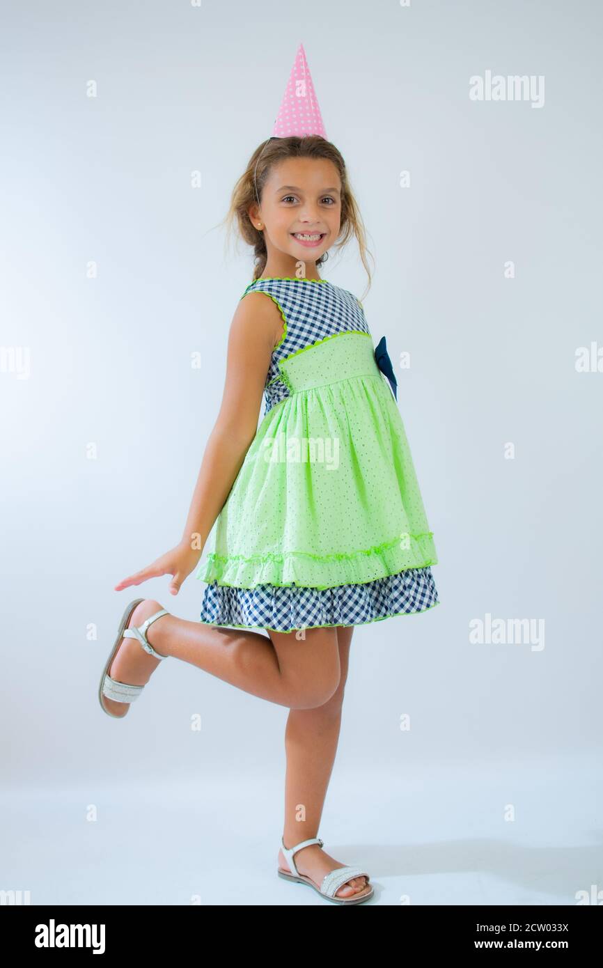 Cute adorable little small girl celebrating birthday standing isolated ...
