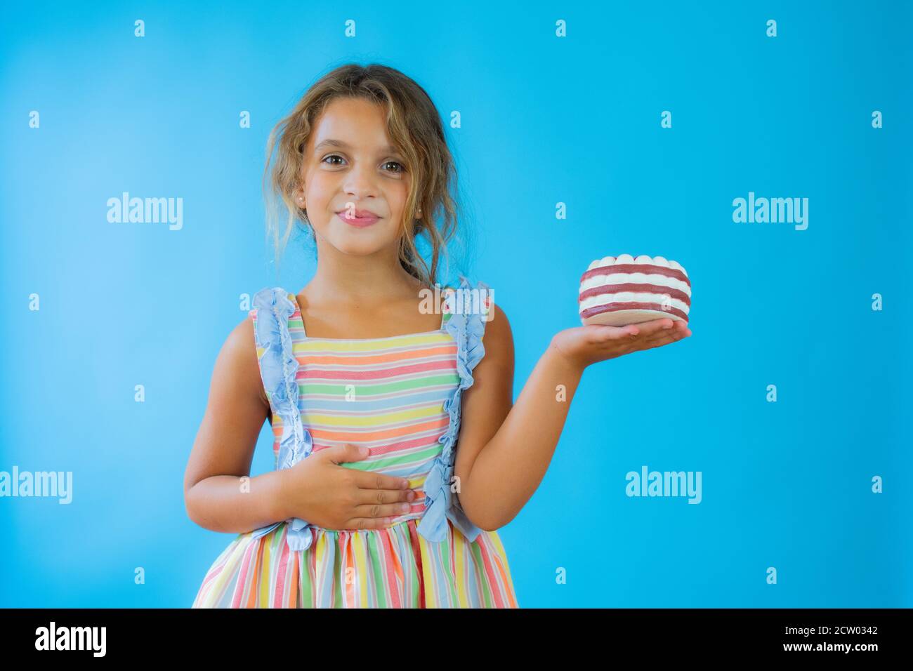 Cute adorable little small girl celebrating birthday standing isolated ...