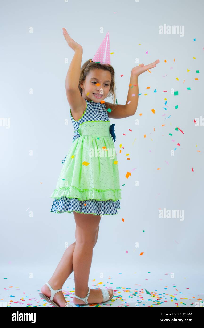 Cute adorable little small girl celebrating birthday standing isolated ...