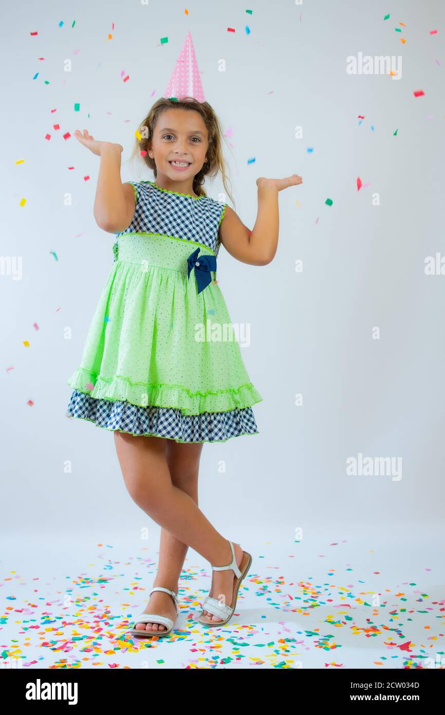 Cute adorable little small girl celebrating birthday standing isolated ...