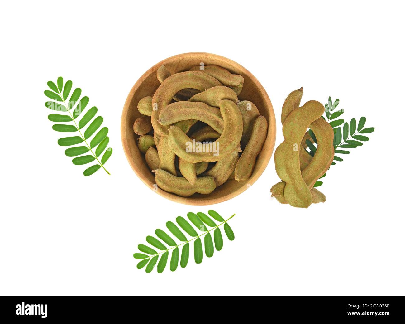 Top view 0f Young Tamarind in wooden bowl and tamarind leaf isolated on ...