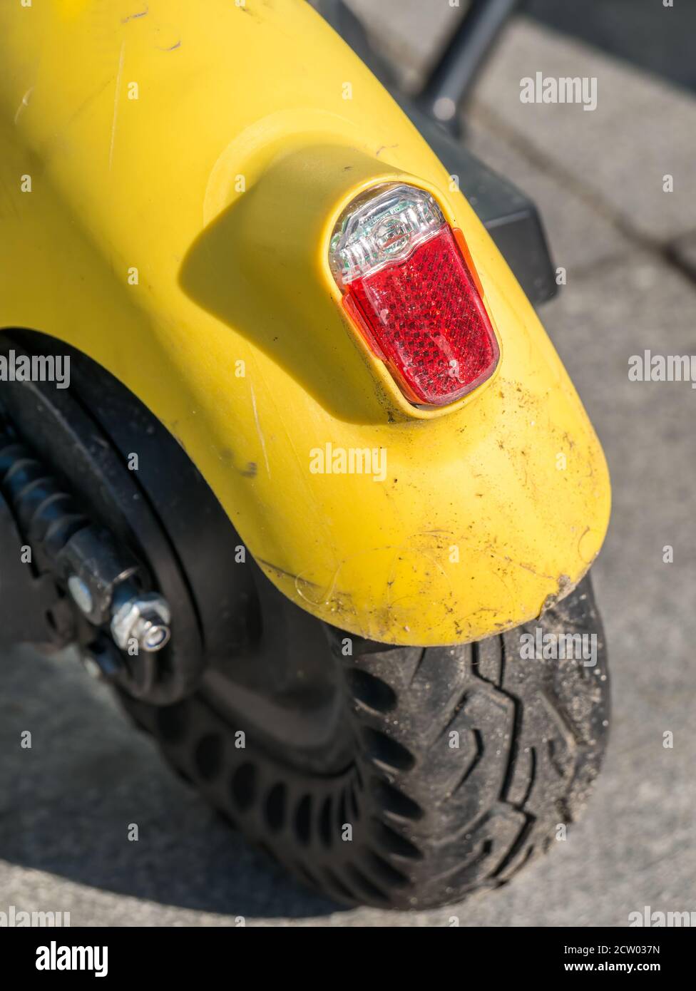 Close up with the wheel and the protection or mud guard of an electric ...