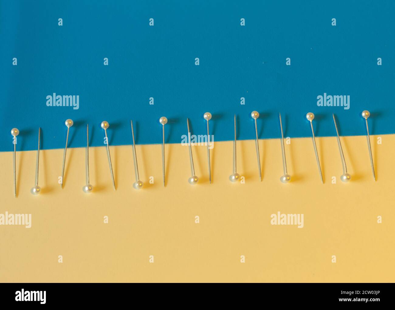 silver office marker pins on plastic of colors Stock Photo - Alamy