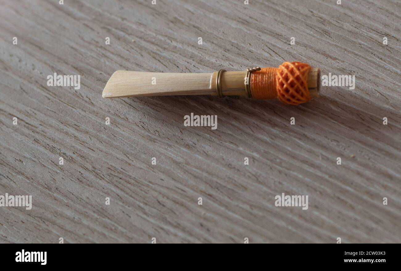 bamboo cane to play the bassoon instrument with orange thread to play ...