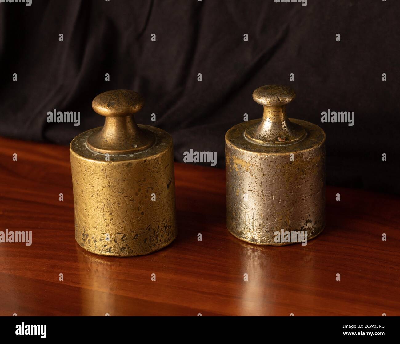 two of the old weights for a scale to buy or check the exact weight of ...