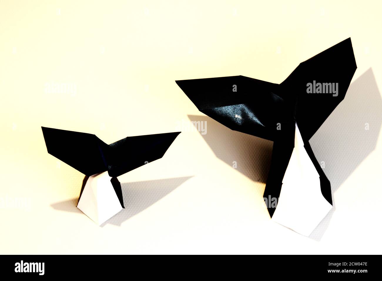 Paper whale tails on a white wall - home decoration Stock Photo - Alamy