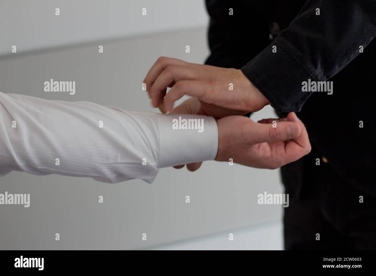 Fixing cuffs hi-res stock photography and images - Alamy