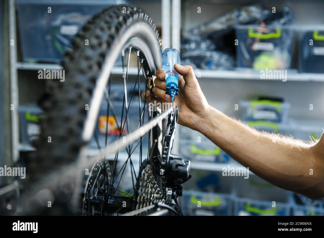 Male oiling bike hi-res stock photography and images - Alamy