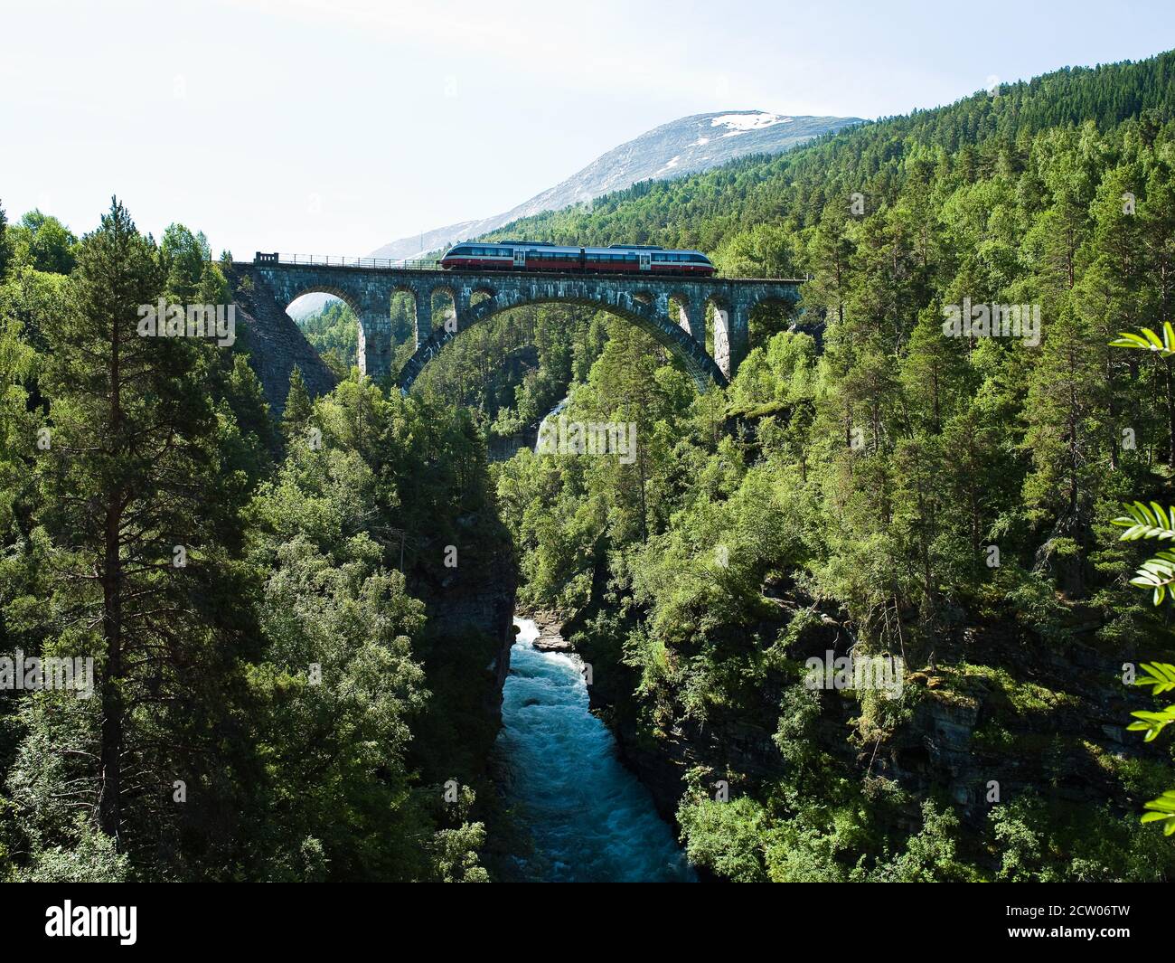 Train crossing Kylling Bridge on the Rauma Line, Romsdalen, Norway ...