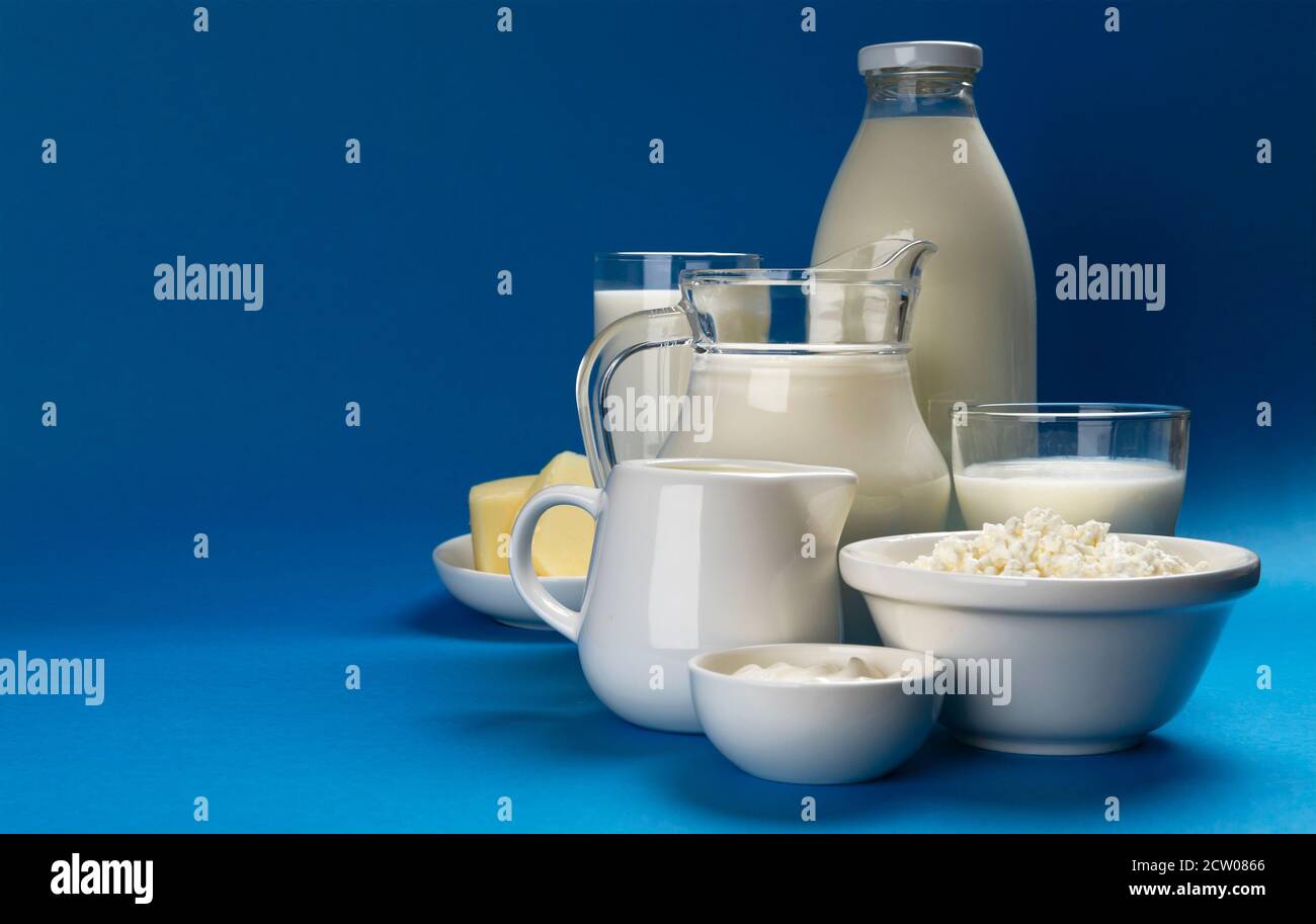 Collection of dairy products on blue background Stock Photo - Alamy