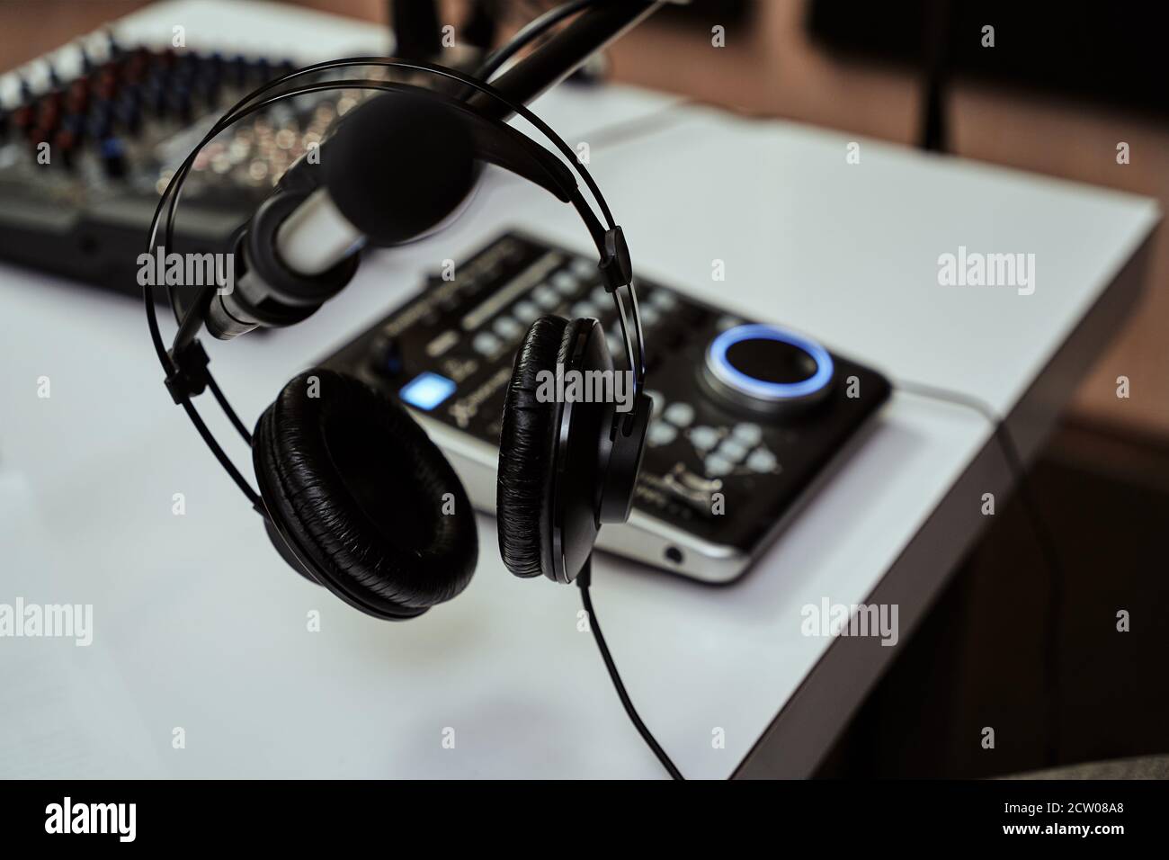 Working place of radio host. Close up of headphones, microphone and ...