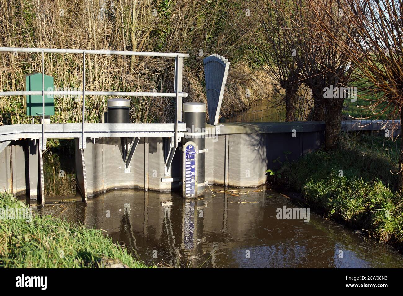 Very small Dutch weir (Dutch: klepstuw) in a ditch. The weir regulates ...