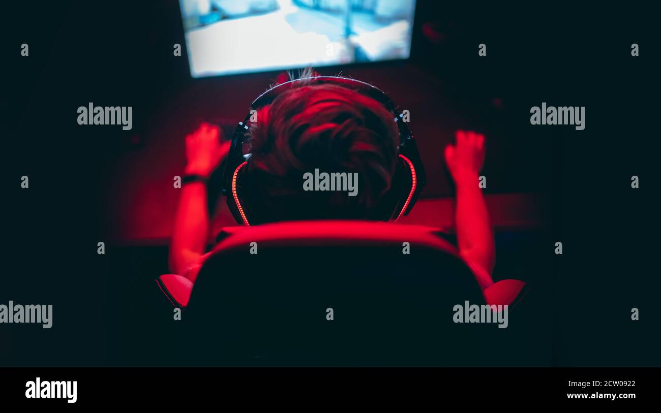 Professional gamer playing online games tournaments pc computer with ...