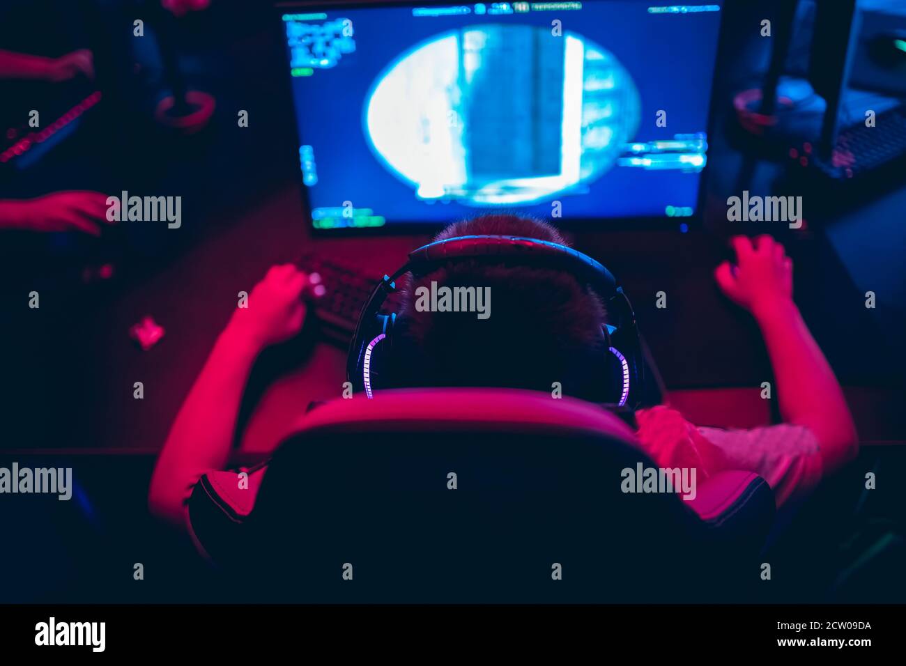 Professional gamer playing online games tournaments pc computer with ...