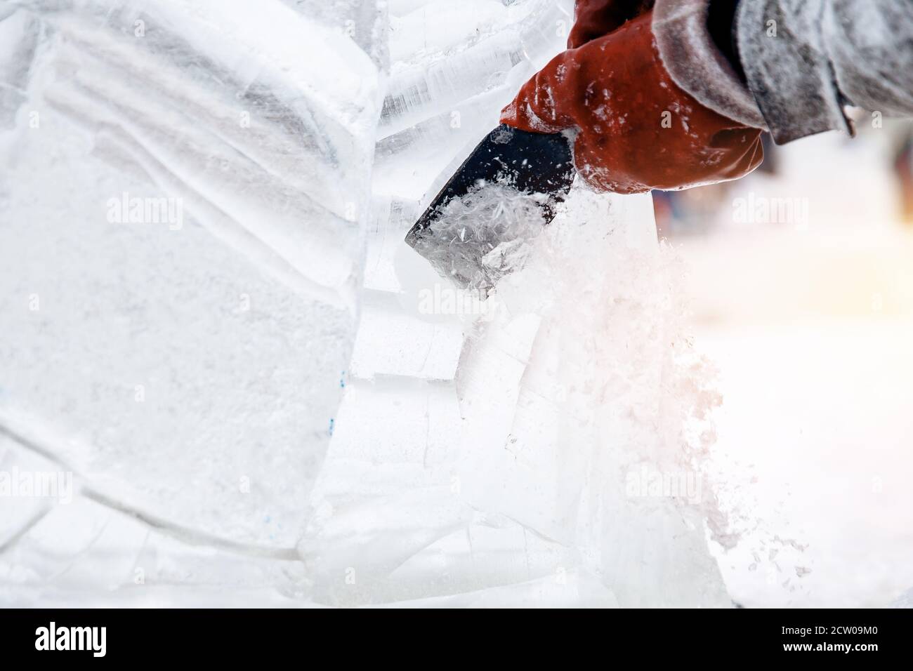 Ice sculpture carving man use chisel cut frozen winter Stock Photo - Alamy