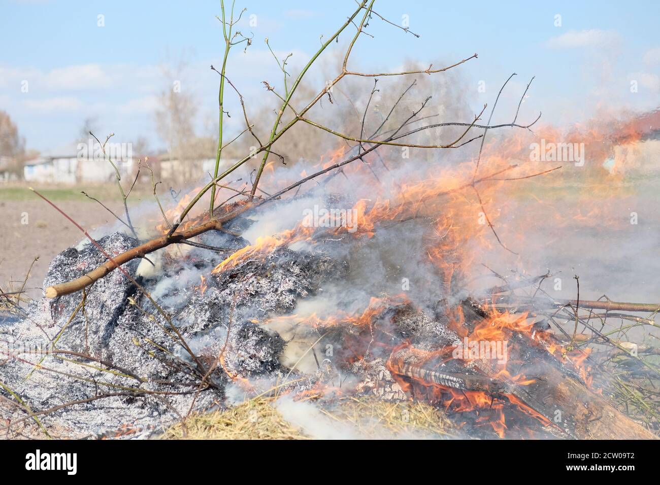Big bonfire in the open air. A pile of ash from burnt boards and ...