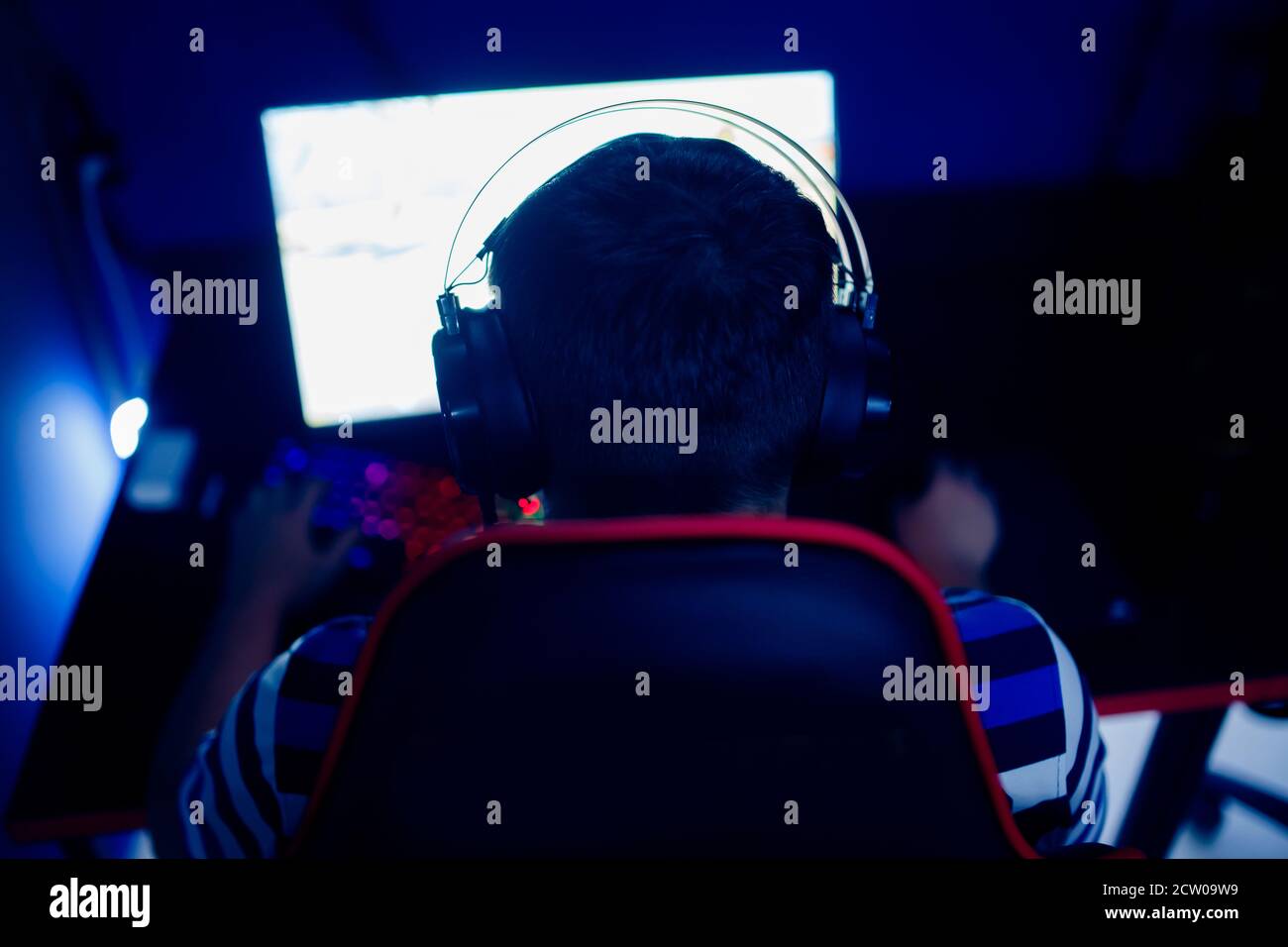 Professional gamer playing online games tournaments pc computer with ...