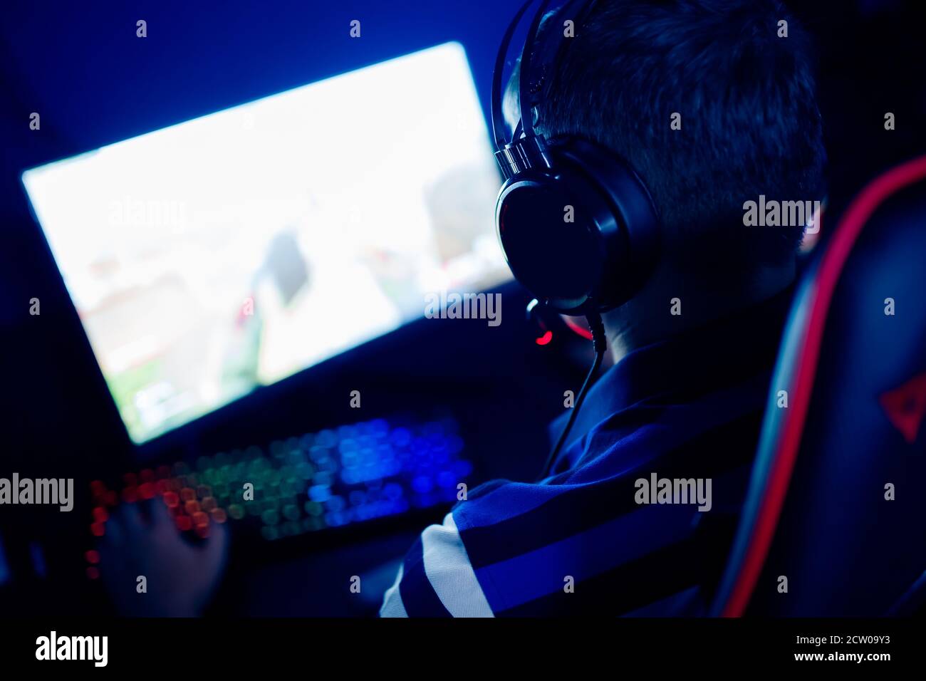 Professional gamer playing online games tournaments pc computer with ...