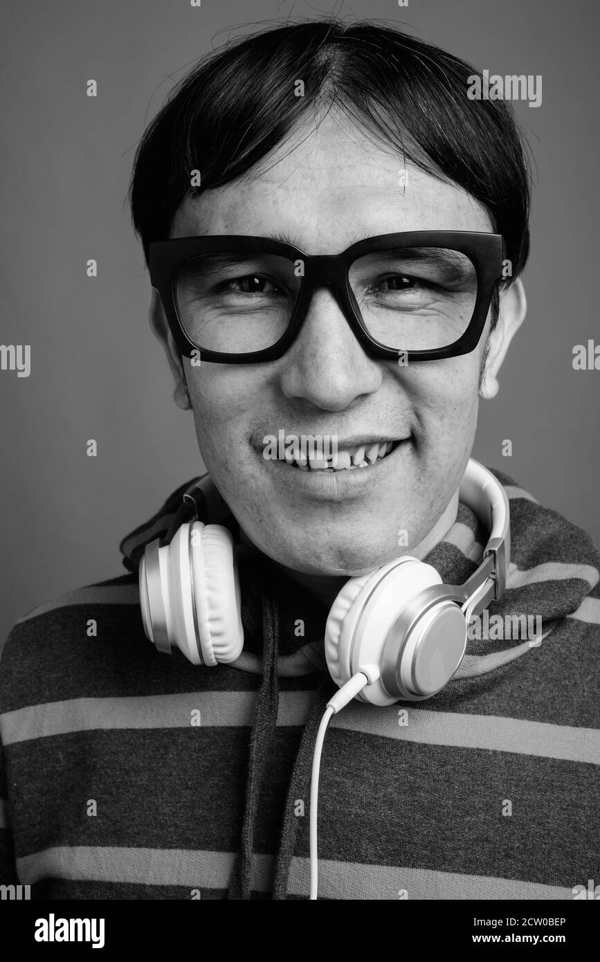 Young man headphones glasses portrait Black and White Stock Photos & Images - Alamy