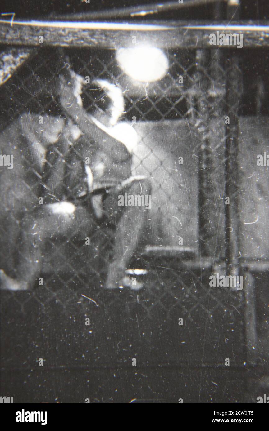 Fine 1970s vintage black and white photography of a young man sitting ...