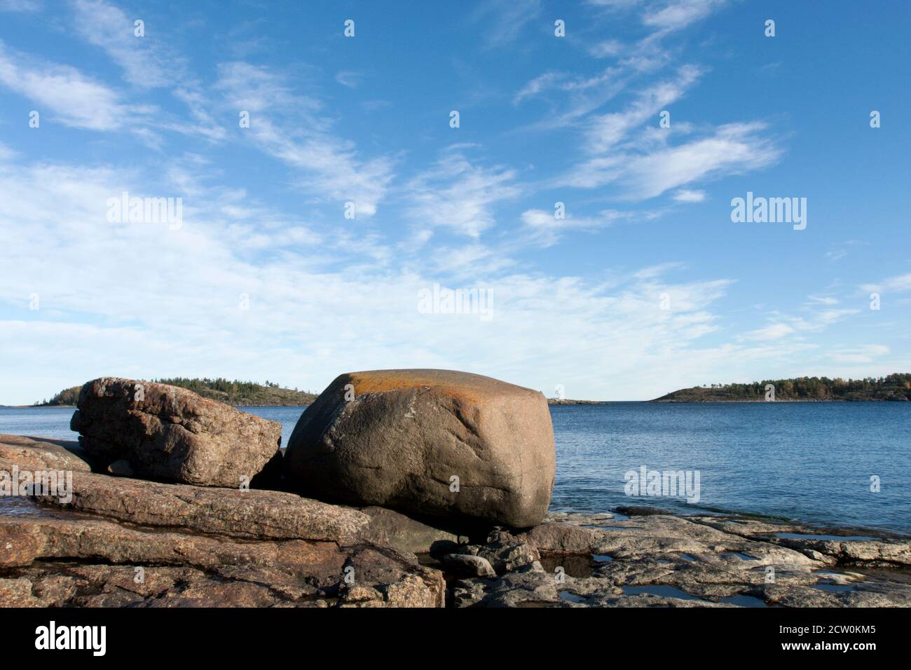 Coast and coastline at High Coast Heritage, Sweden. Huge boulders ...